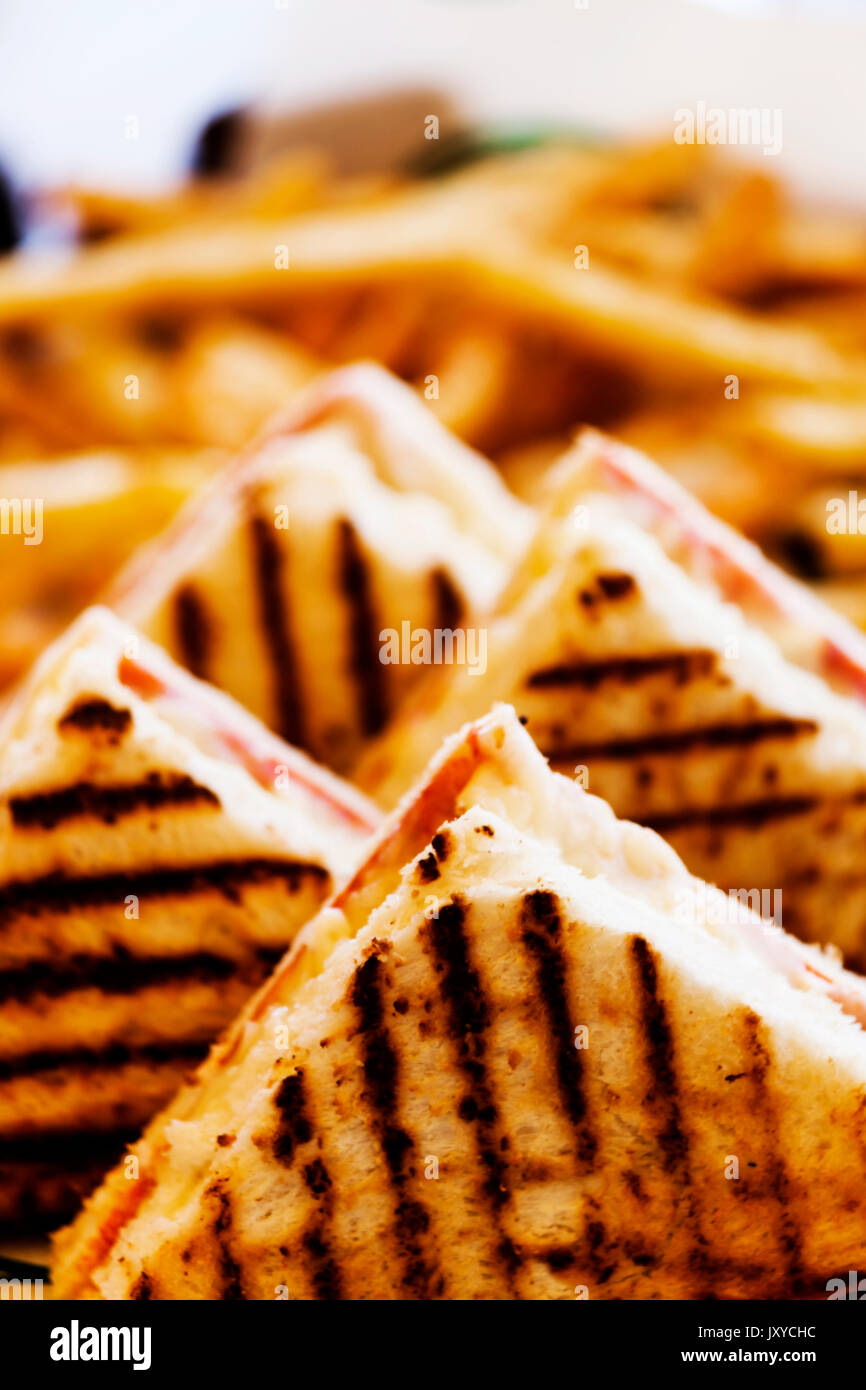 Fast food: Toast with cheese and french fries Stock Photo - Alamy