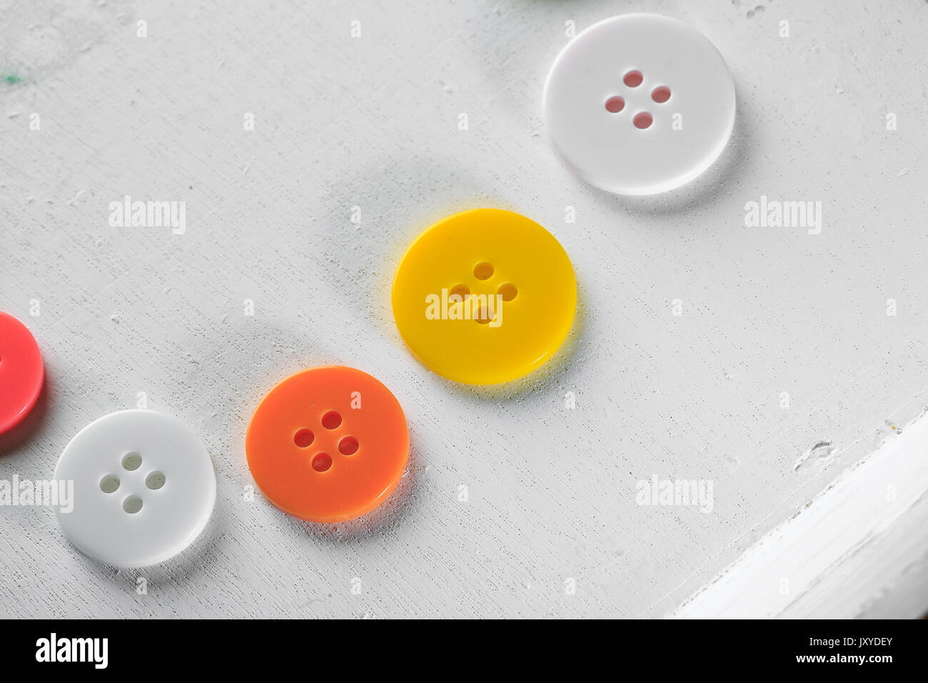 Group of color buttons in a white box Stock Photo - Alamy