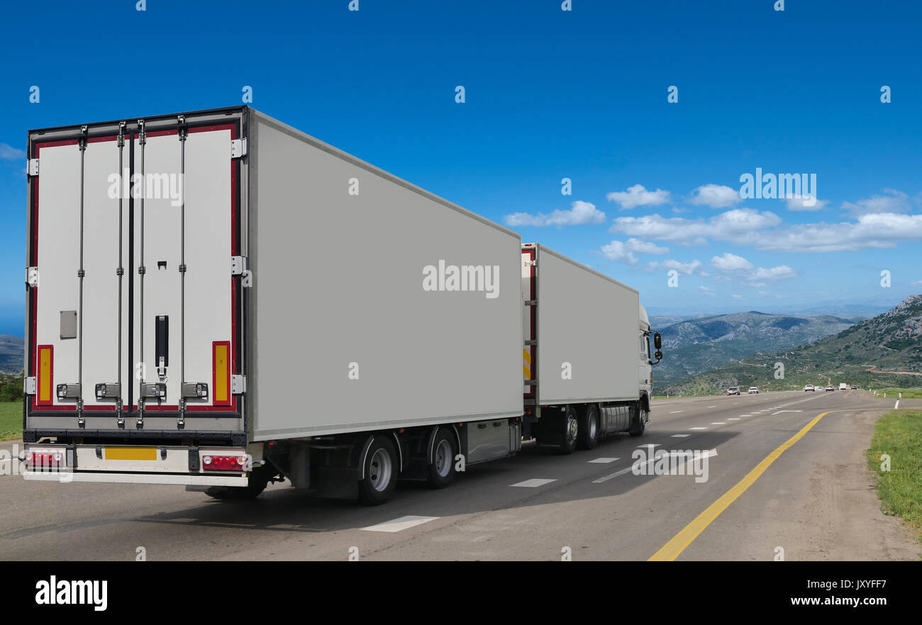 Container on the big highway. transport loads Stock Photo - Alamy