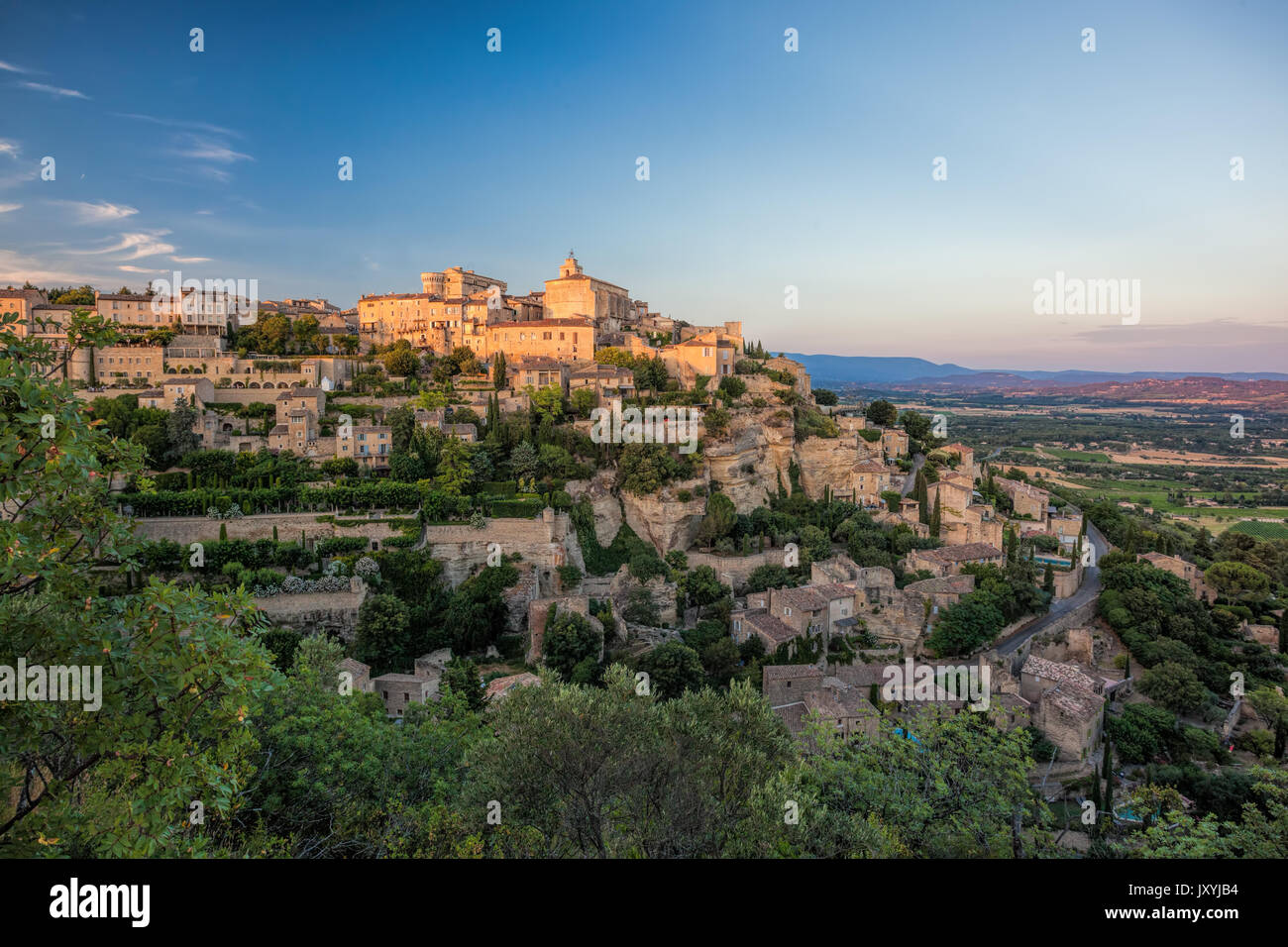 Famous old village Gordes in Provence against sunset in France Stock ...