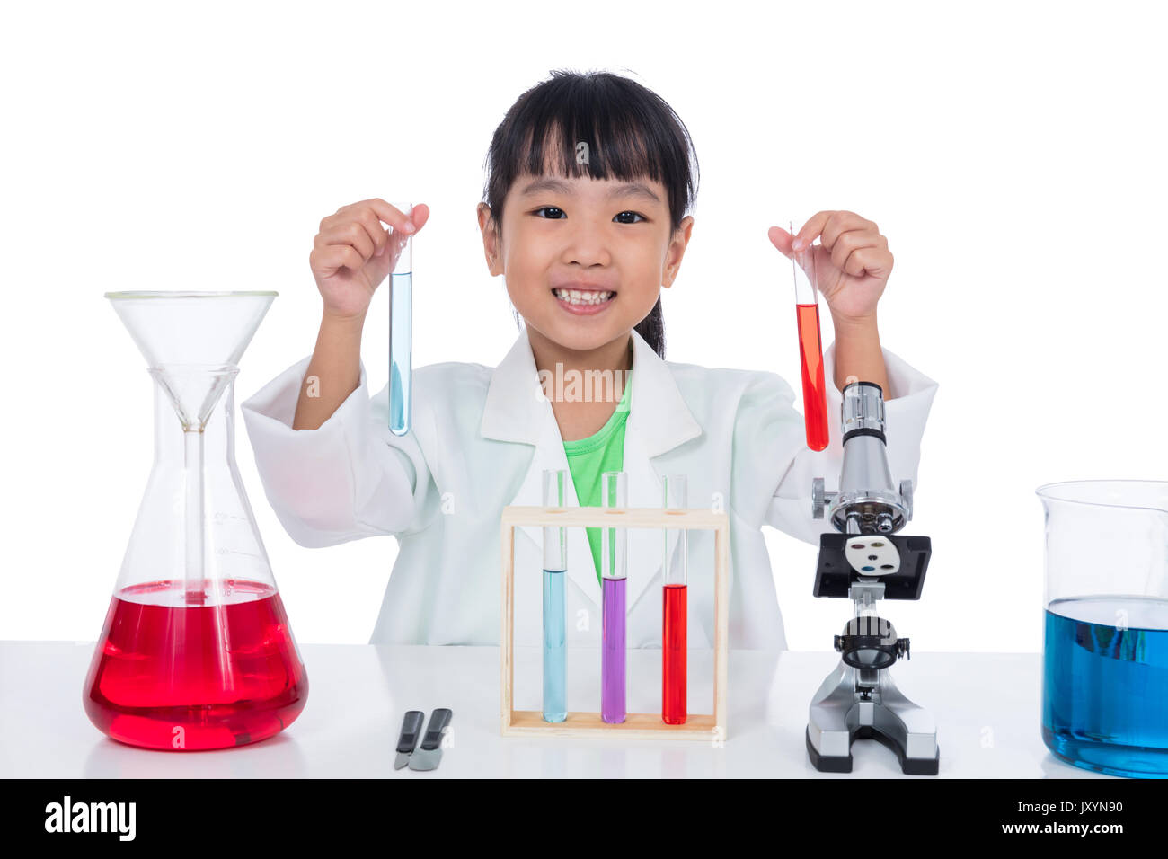 Asian Chinese little girl working with test tube in isolated white ...