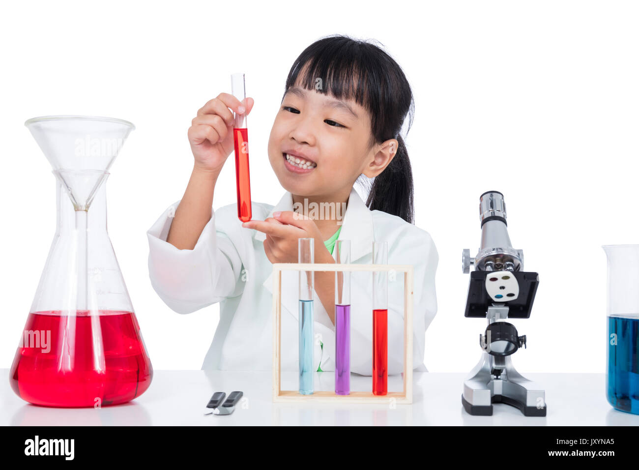 Asian Chinese little girl working with test tube in isolated white ...