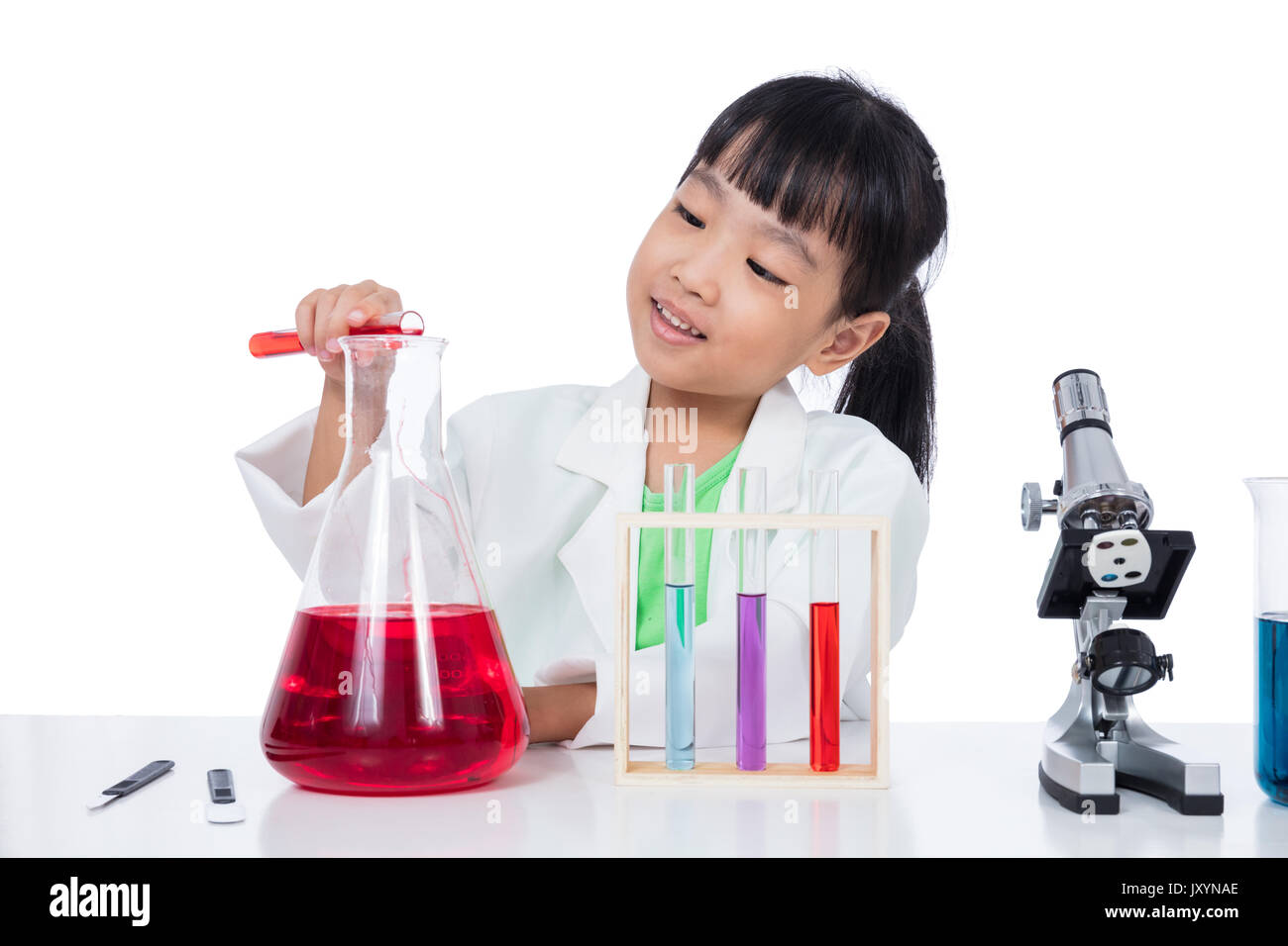 Asian Chinese little girl working with test tube in isolated white ...