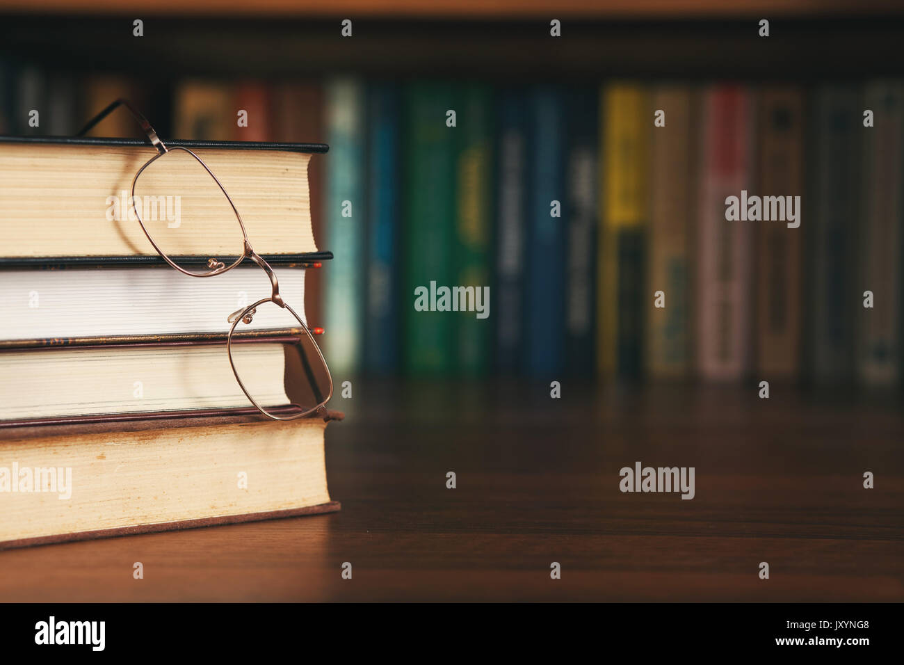 education, science and books concept - pile of books and glasses Stock ...