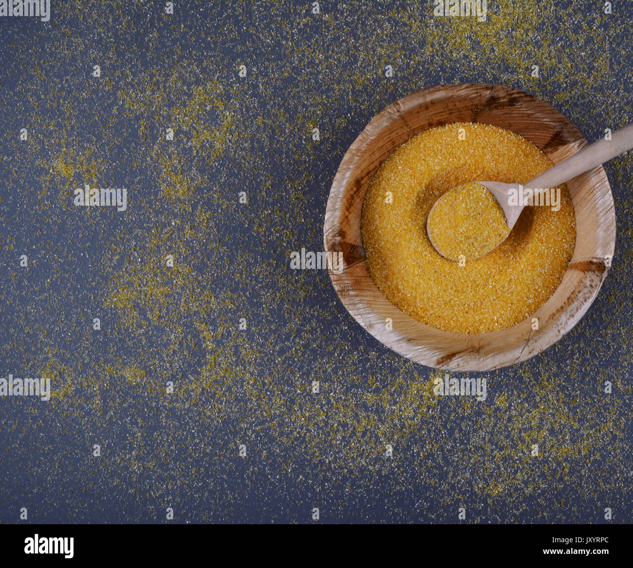 Corn meal of dry polenta on dark background. Flat lay style Stock Photo ...