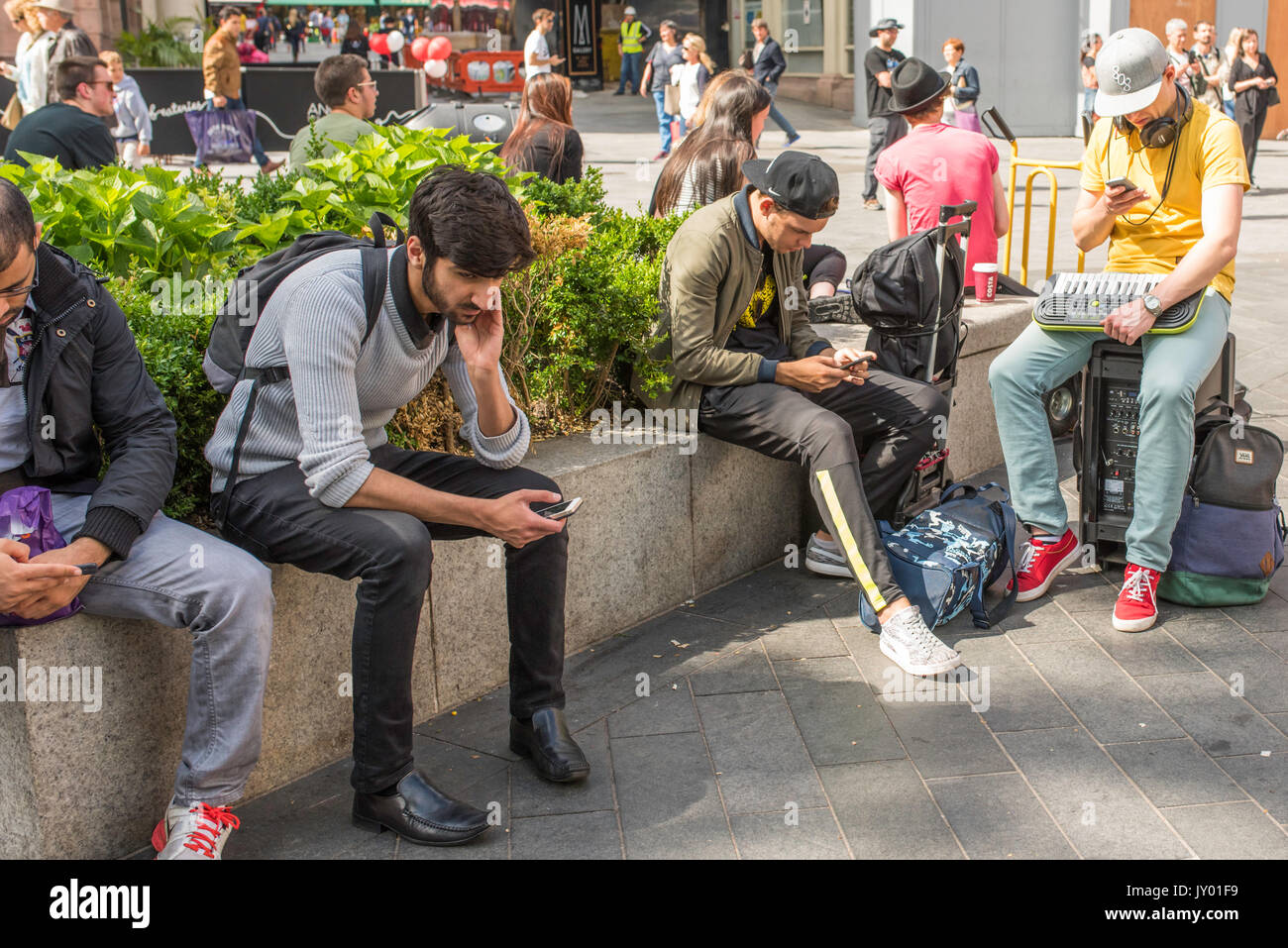 Crowd with cell phones hi-res stock photography and images - Alamy