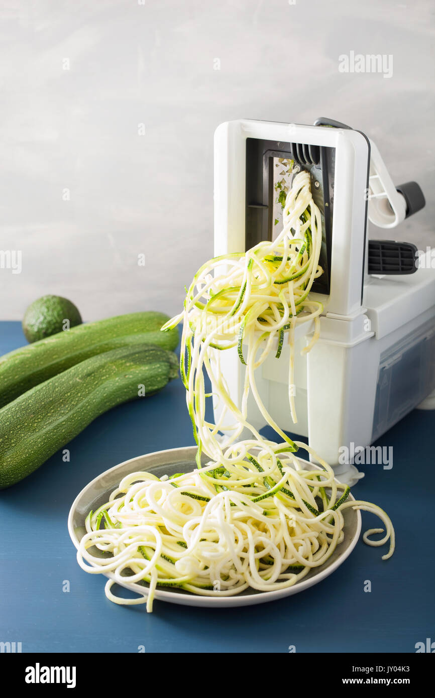 spiralizing courgette raw vegetable with spiralizer Stock Photo - Alamy
