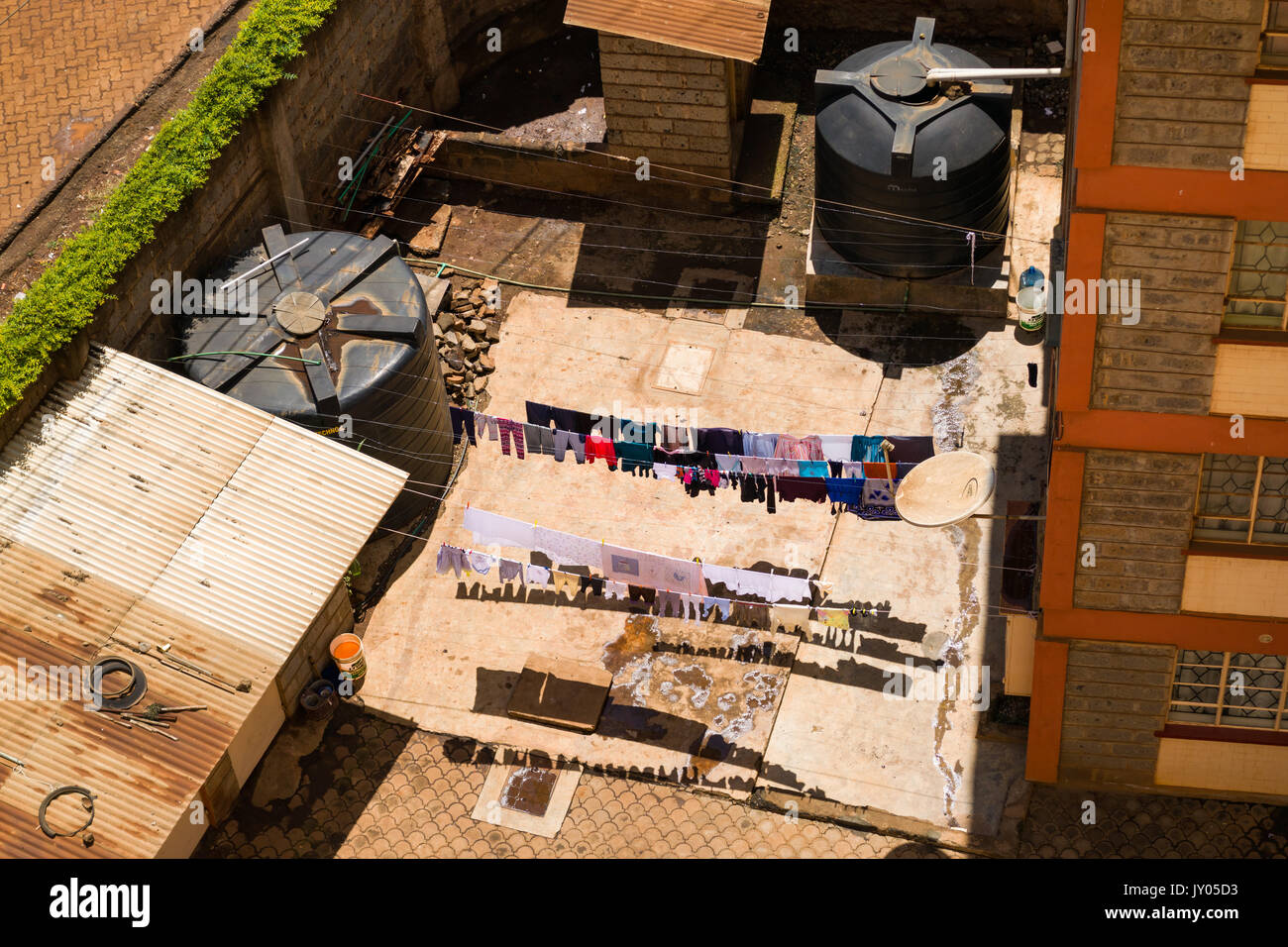 Corrugated roof shacks with washing hanging out to dry, Ruaka town ...