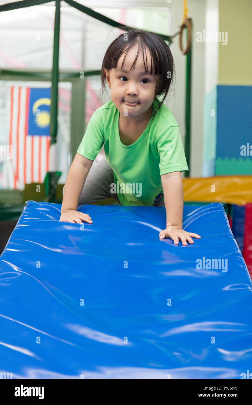 Asian Chinese little girl playing at indoor playground Stock Photo - Alamy