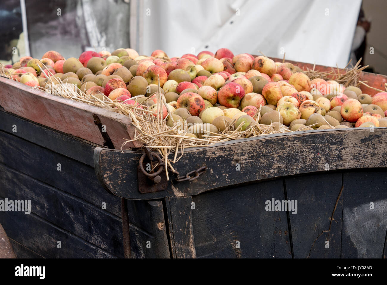 Battered and bruised apples in an old cart Stock Photo - Alamy