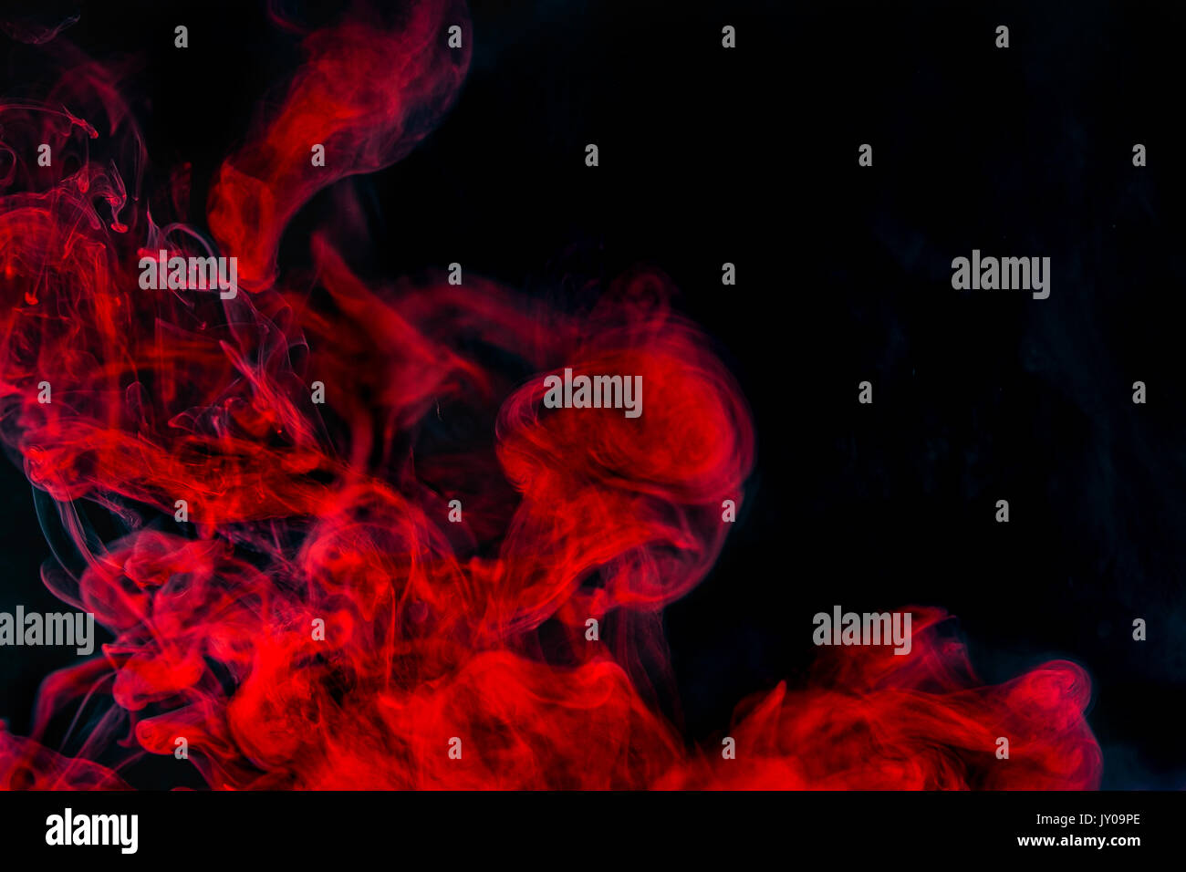 Abstract background, red smoke texture in the air. Smoke fragments ...