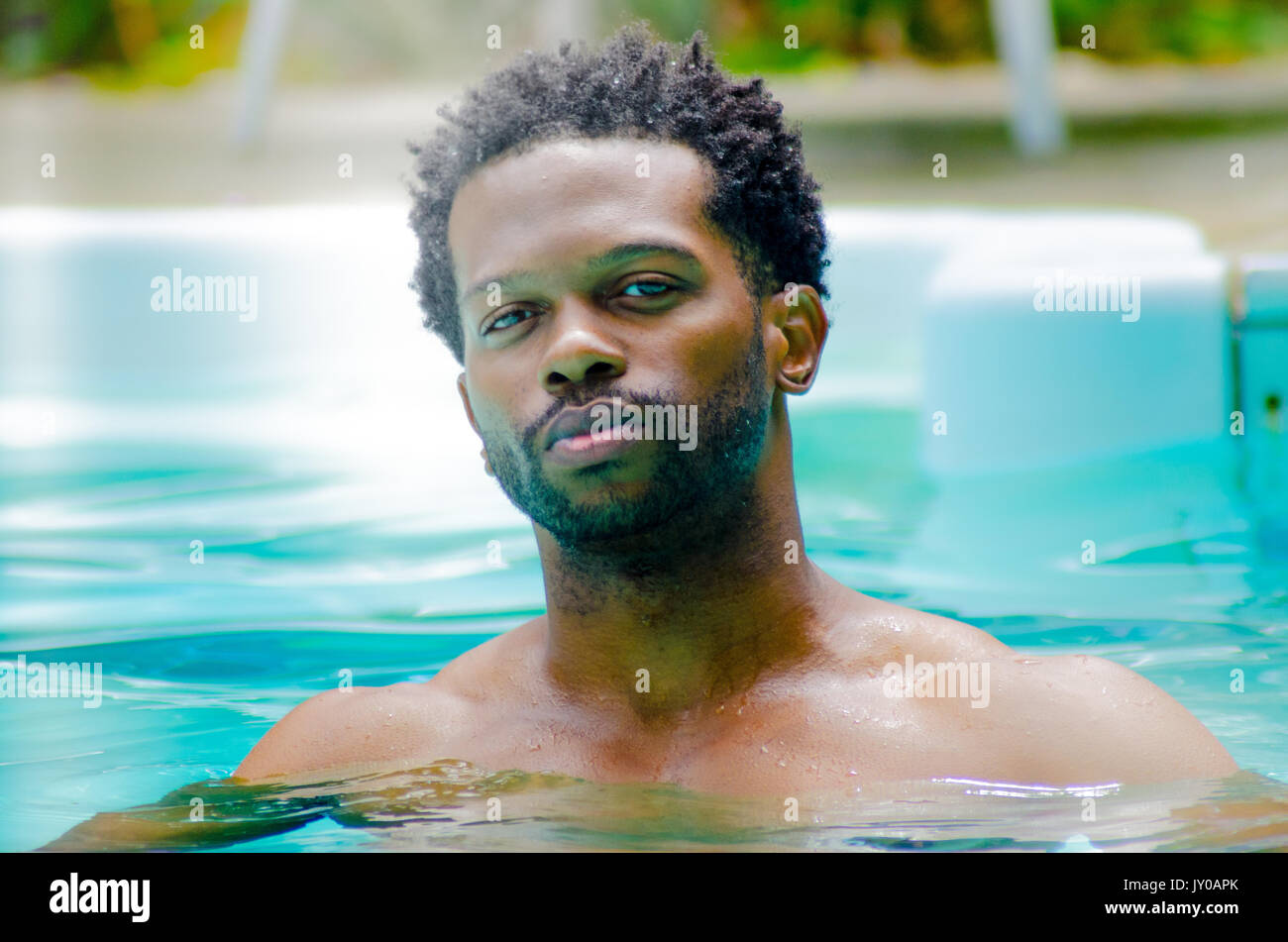 male physique model bodybuilder in pool Stock Photo - Alamy