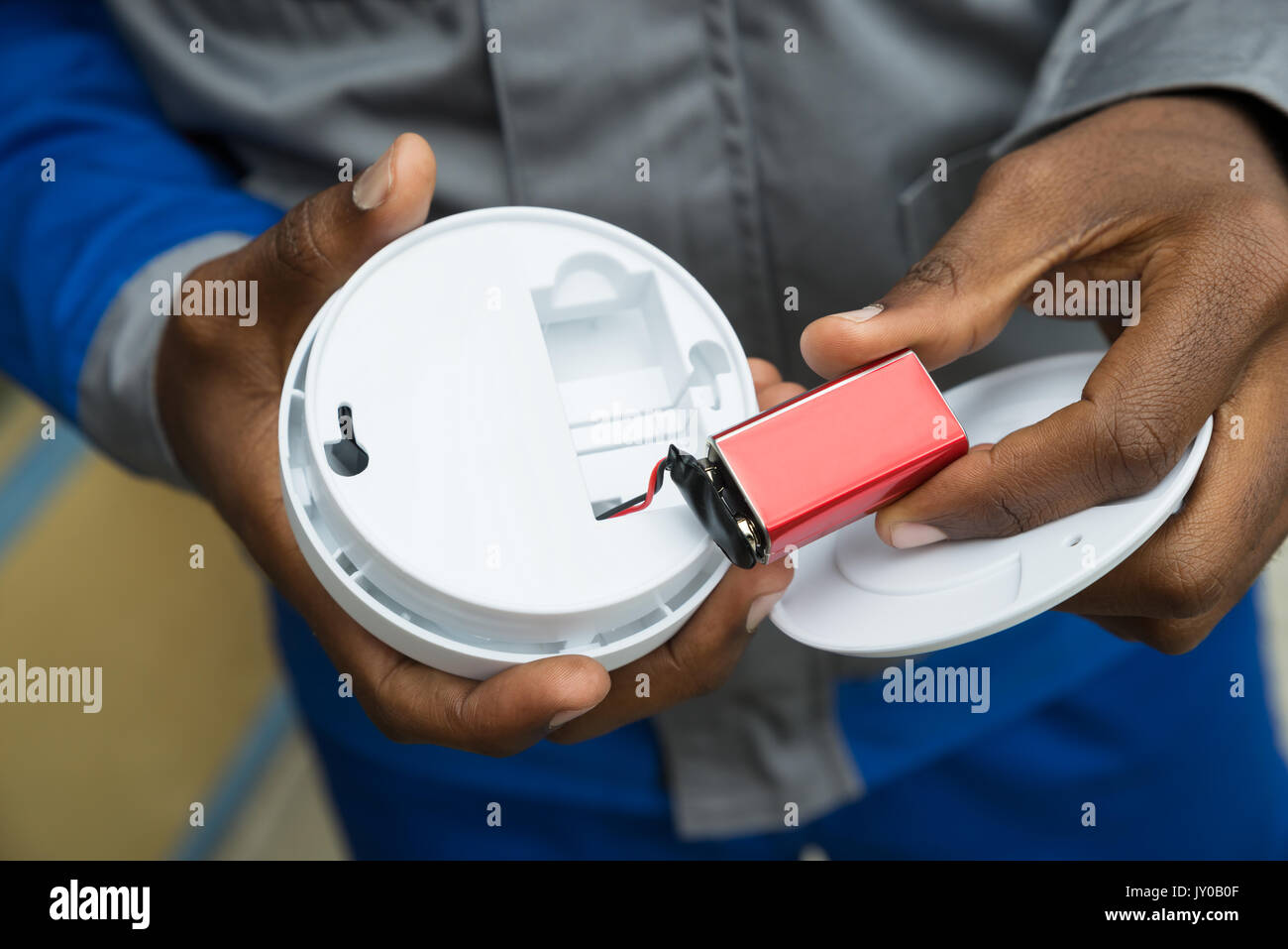 Close-up Of Electrician Hands Removing Battery From Smoke Detector ...
