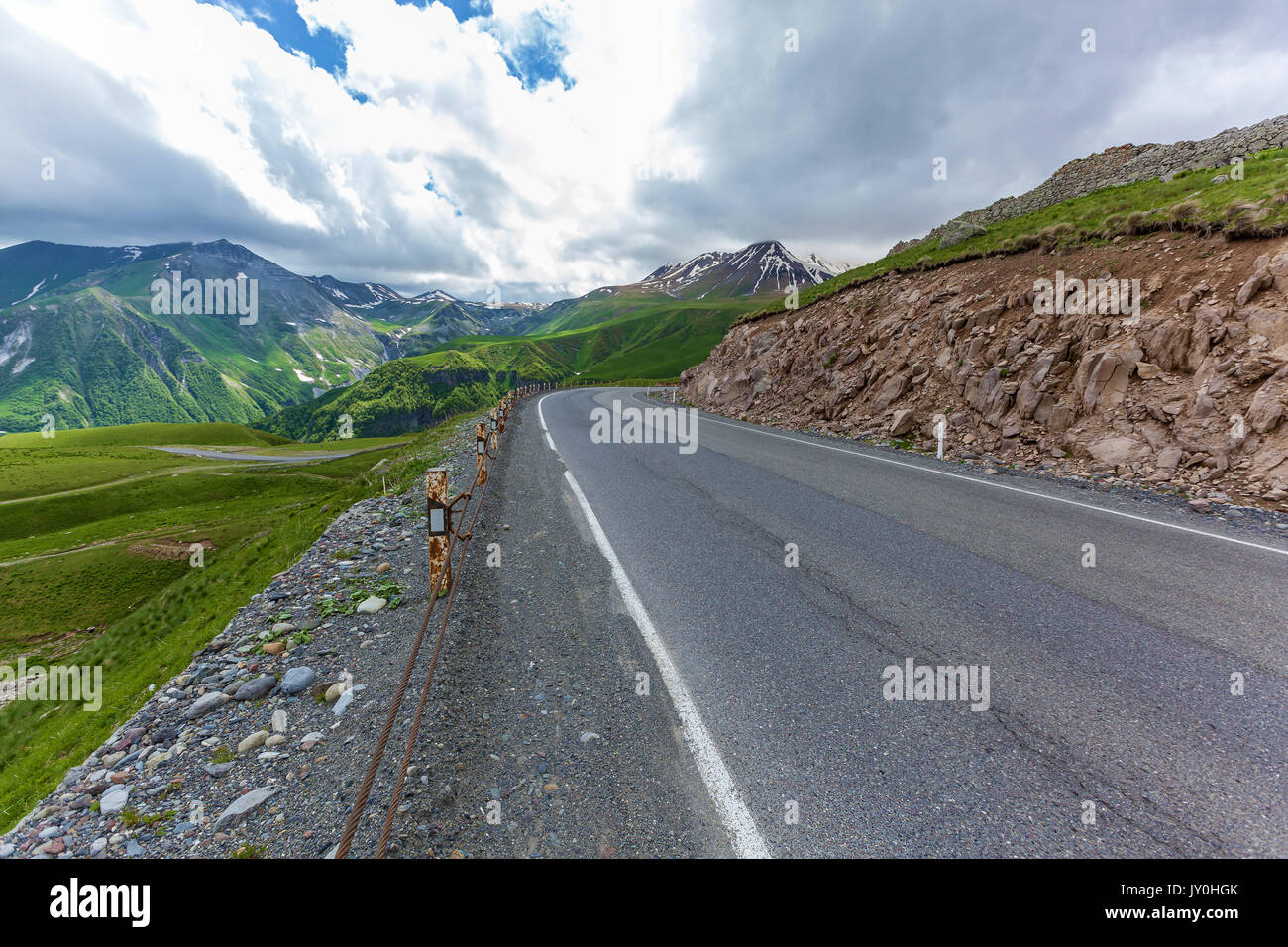Mountain road through a mountain pass, Kazbegi and military Georgian ...