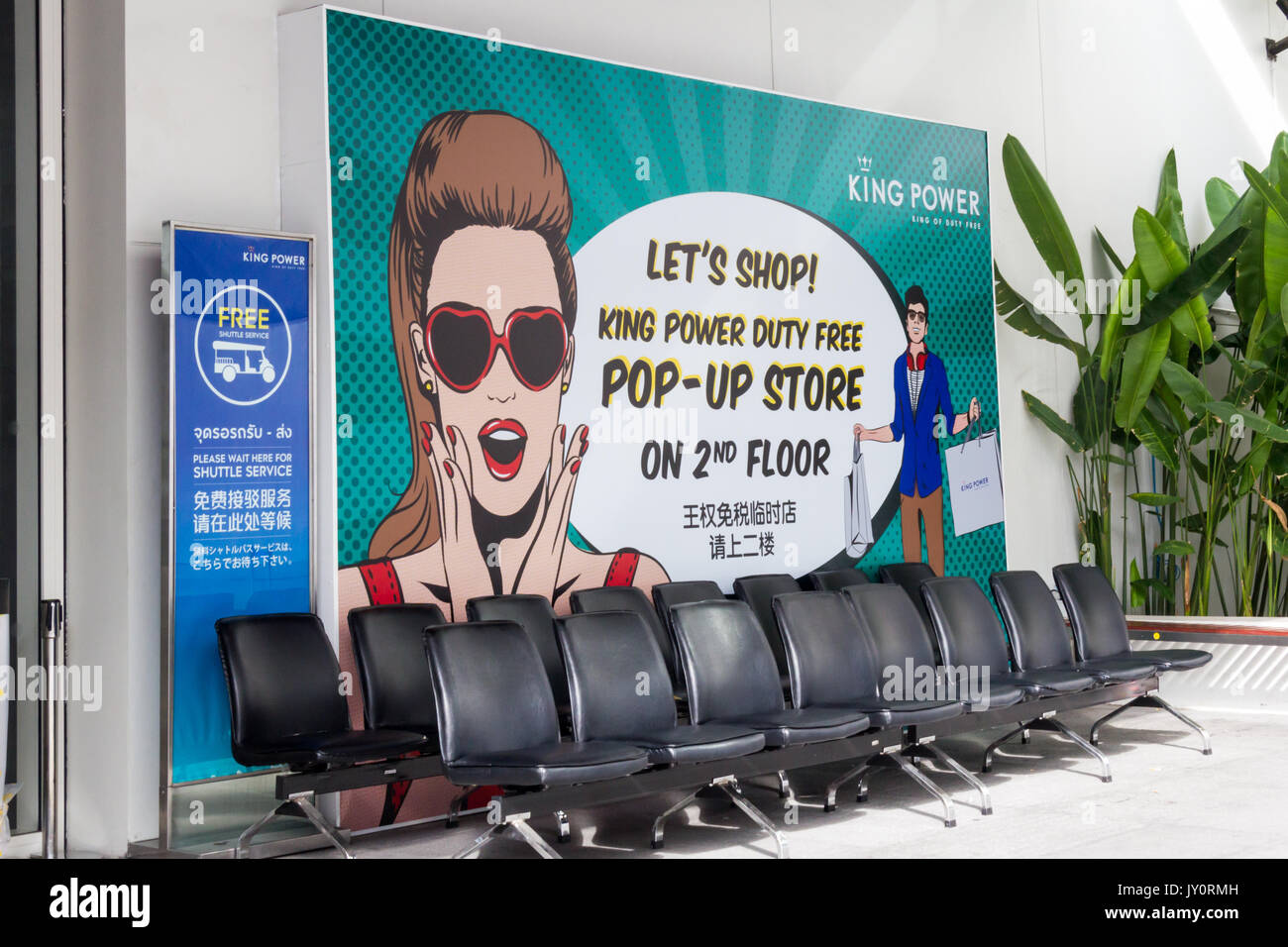 Seating for free shuttle bus outside the King Power duty free store ...