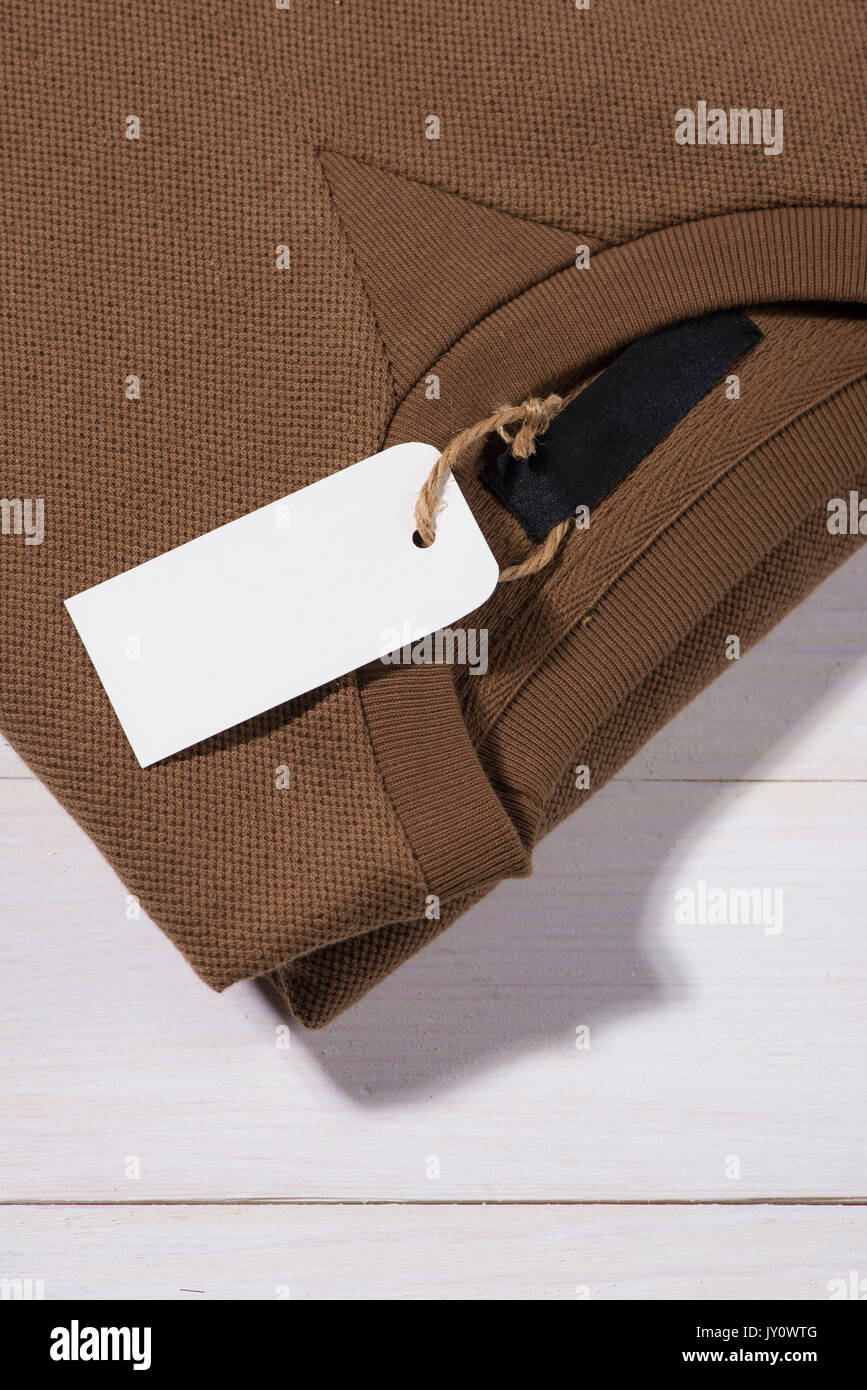 Shirt price tag. Rectangular tag is attached to a sweater Stock Photo ...