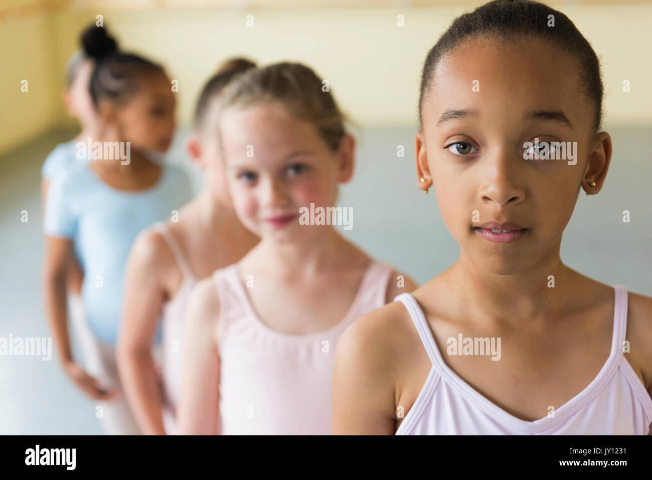 Girls standing in a row in ballet studio Stock Photo - Alamy