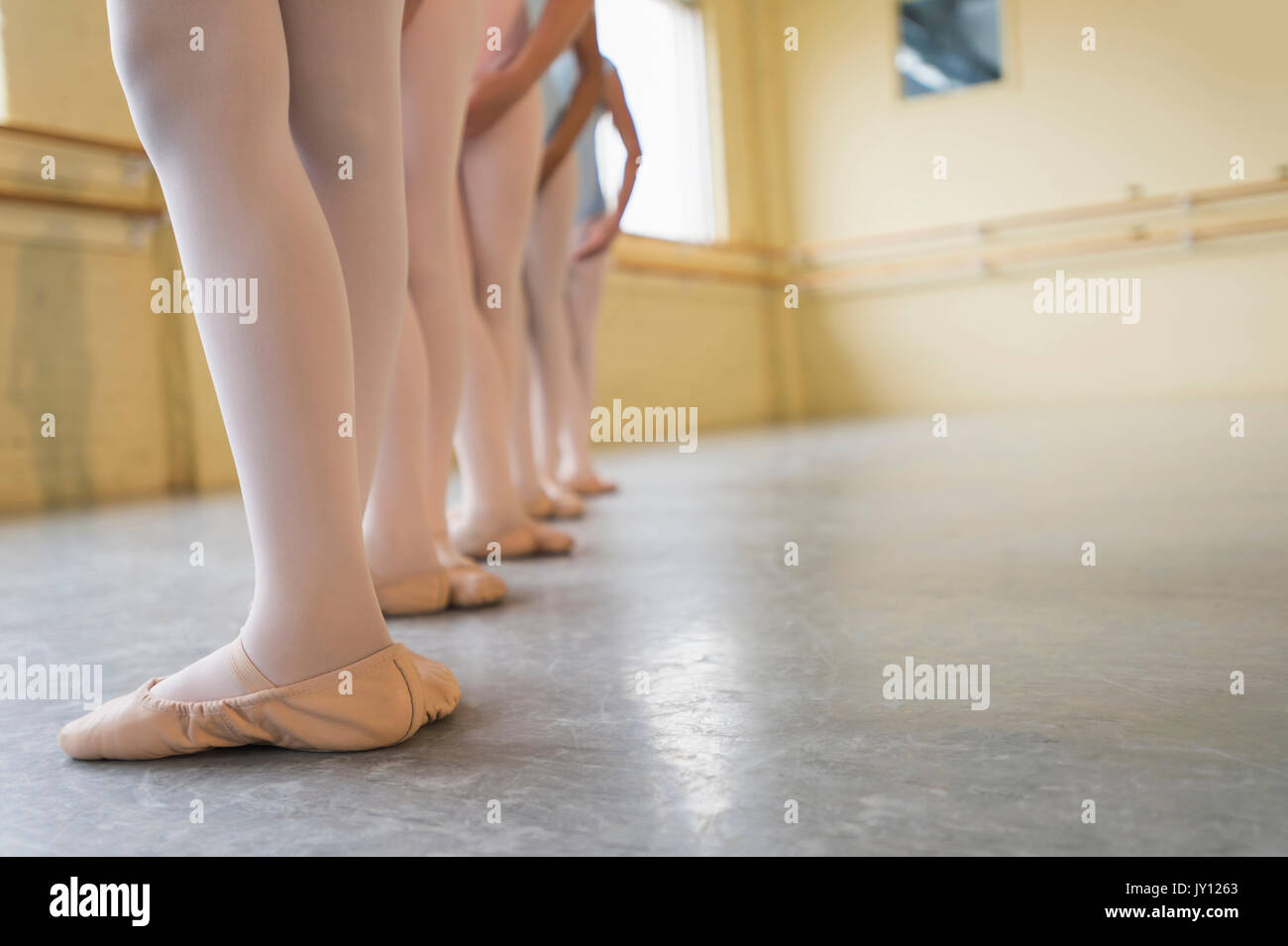 Legs of girls in ballet studio Stock Photo - Alamy