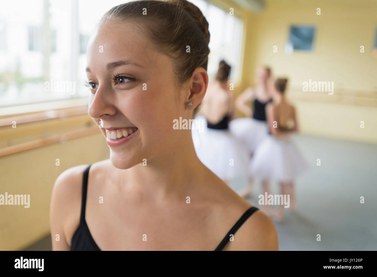 Portrait of smiling girl in ballet studio Stock Photo - Alamy