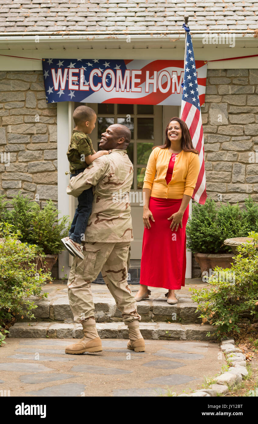 African American boy greeting returning soldier father Stock Photo - Alamy