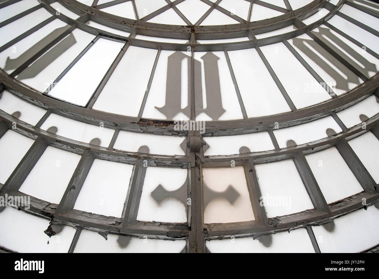 Crumbling paintwork on the interior of one of the four clock faces with ...