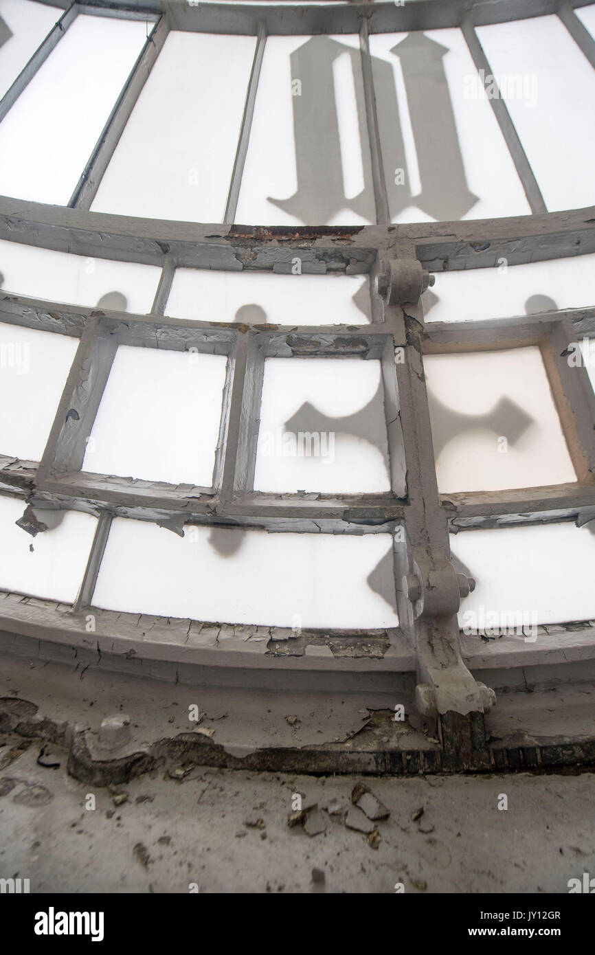 Crumbling paintwork on the interior of one of the four clock faces with ...