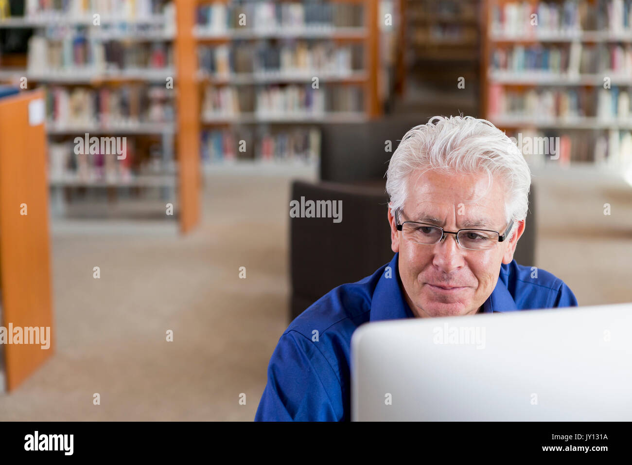 Man using computer back view hi-res stock photography and images - Alamy