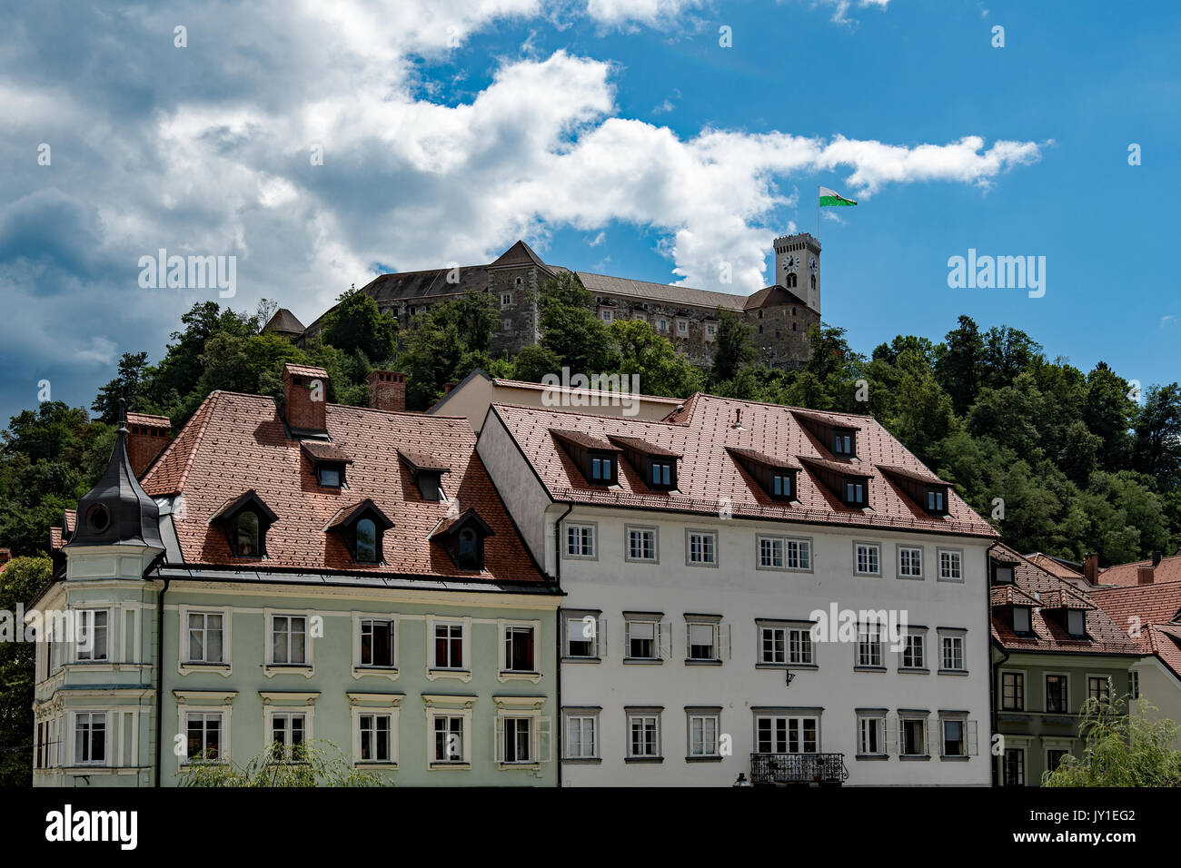 The facades of the houses under the castle Stock Photo - Alamy