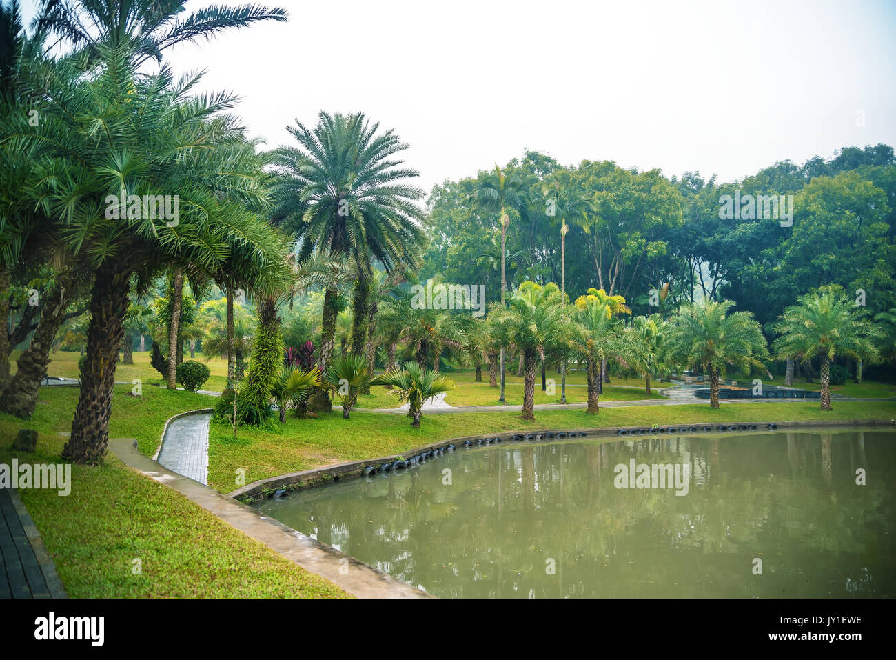 View on the beautiful landscaped park with pond Stock Photo - Alamy
