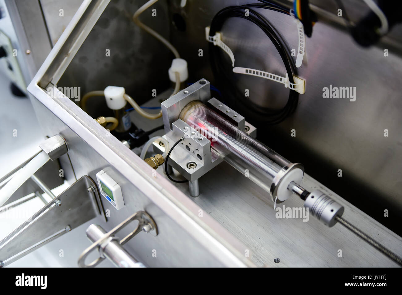 Fragment of vapour testing machine for e-cig production Stock Photo - Alamy