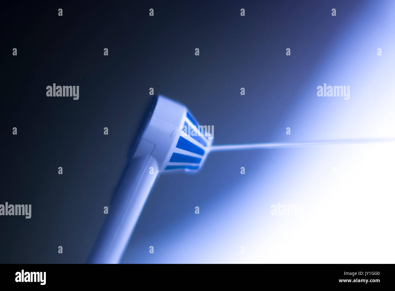 Dental water spray cleaner for interdental hygiene Stock Photo - Alamy