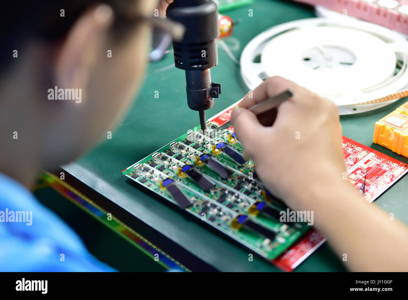 Engineer making a soldering on hardware microchip Stock Photo - Alamy