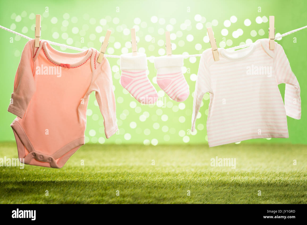 Washing line with baby clothing hi-res stock photography and images - Alamy
