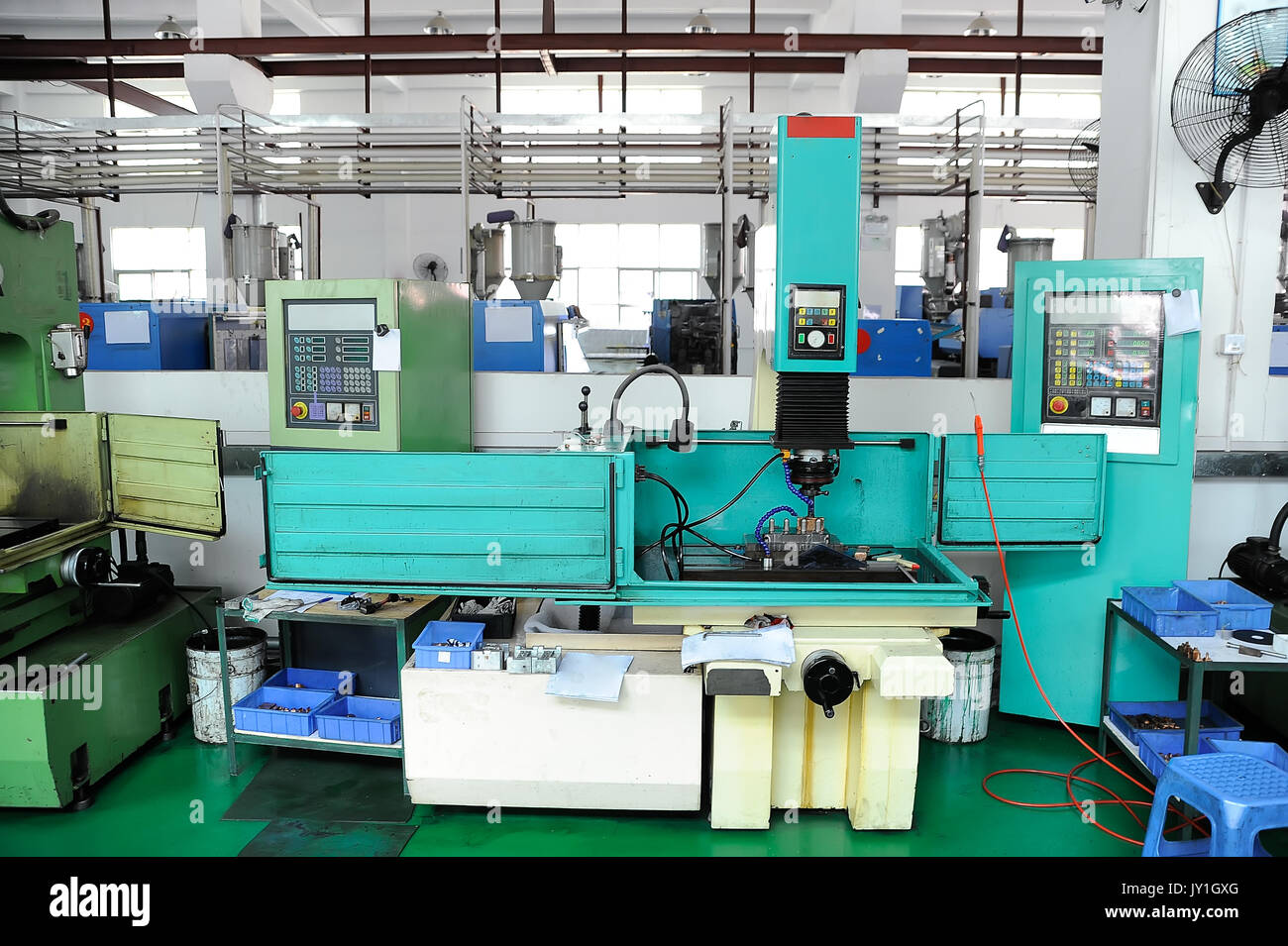 CNC machines during the process at empty workshop Stock Photo - Alamy