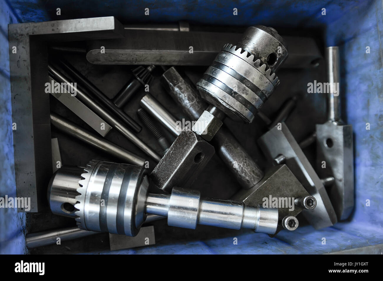 Heap of tools for CNC machine in the box Stock Photo - Alamy