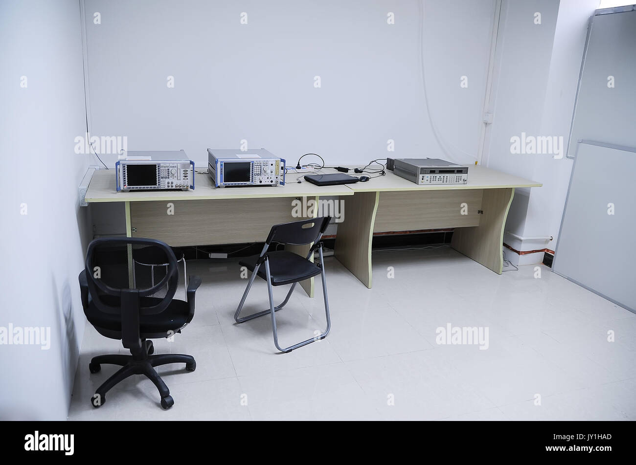 Working station equipment in empty testing room Stock Photo - Alamy