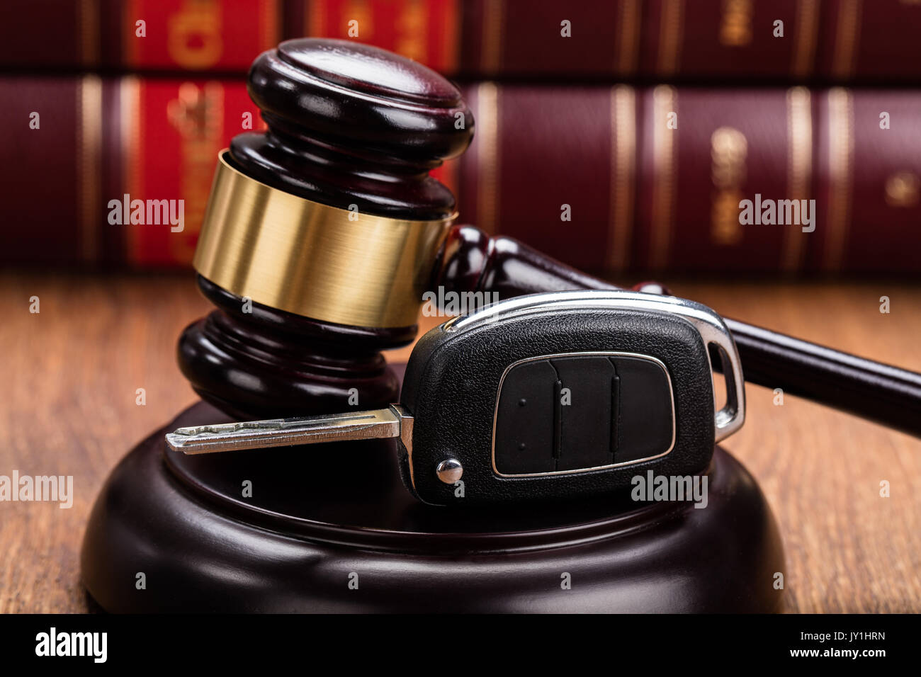 Car Key On Judges Gavel At Wooden Desk In Courtroom Stock Photo - Alamy