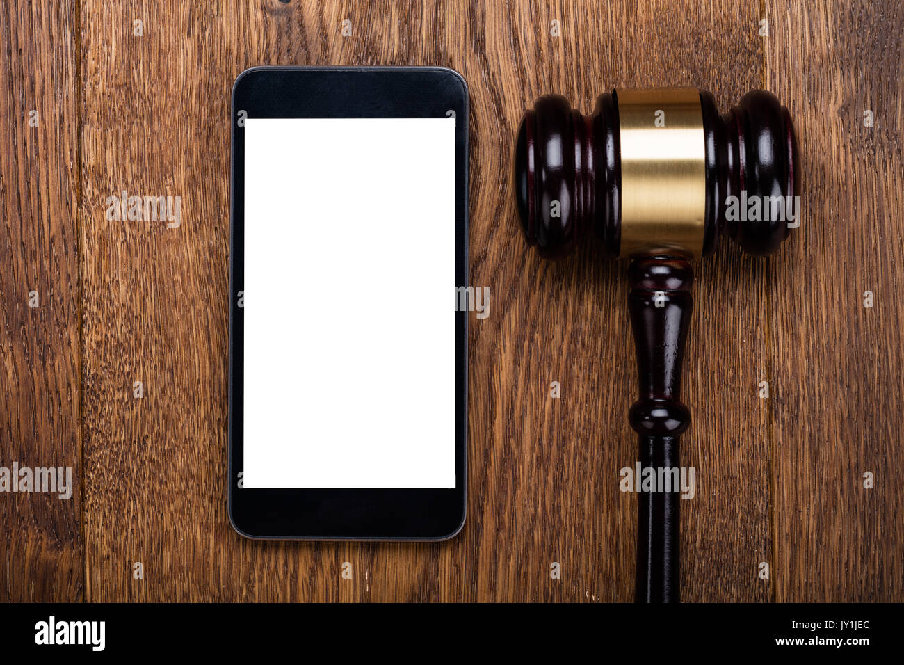 High Angle View Of Judge Gavel And Smartphone Showing Blank Screen On ...