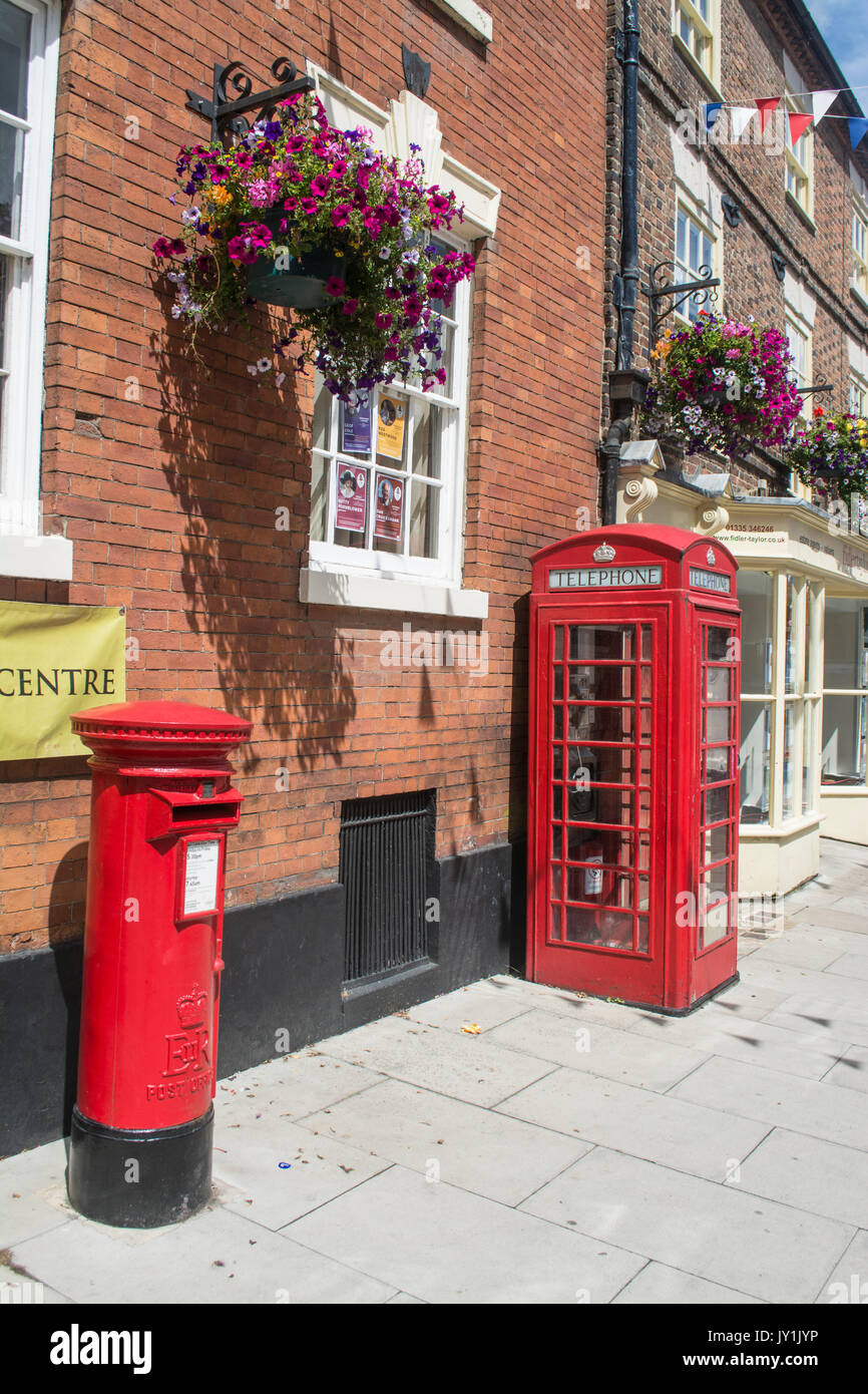 Traditional red telephone box and post box on Church Street in ...