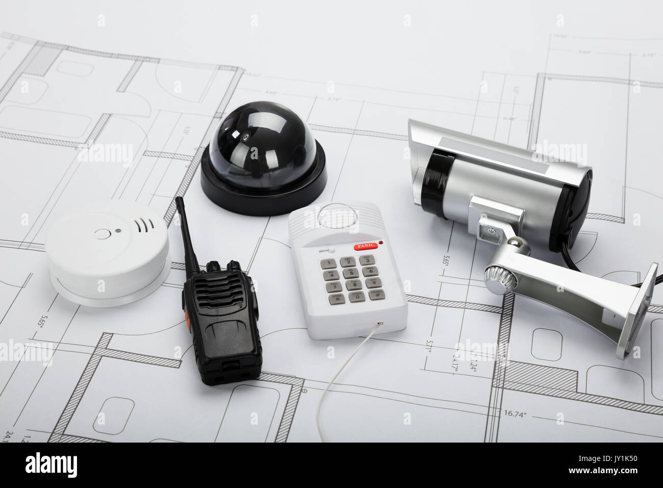 High Angle View Of Security Equipment On Blueprint In Office Stock ...
