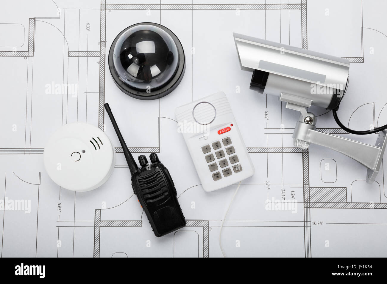 High Angle View Of Security Equipment On Blueprint In Office Stock ...