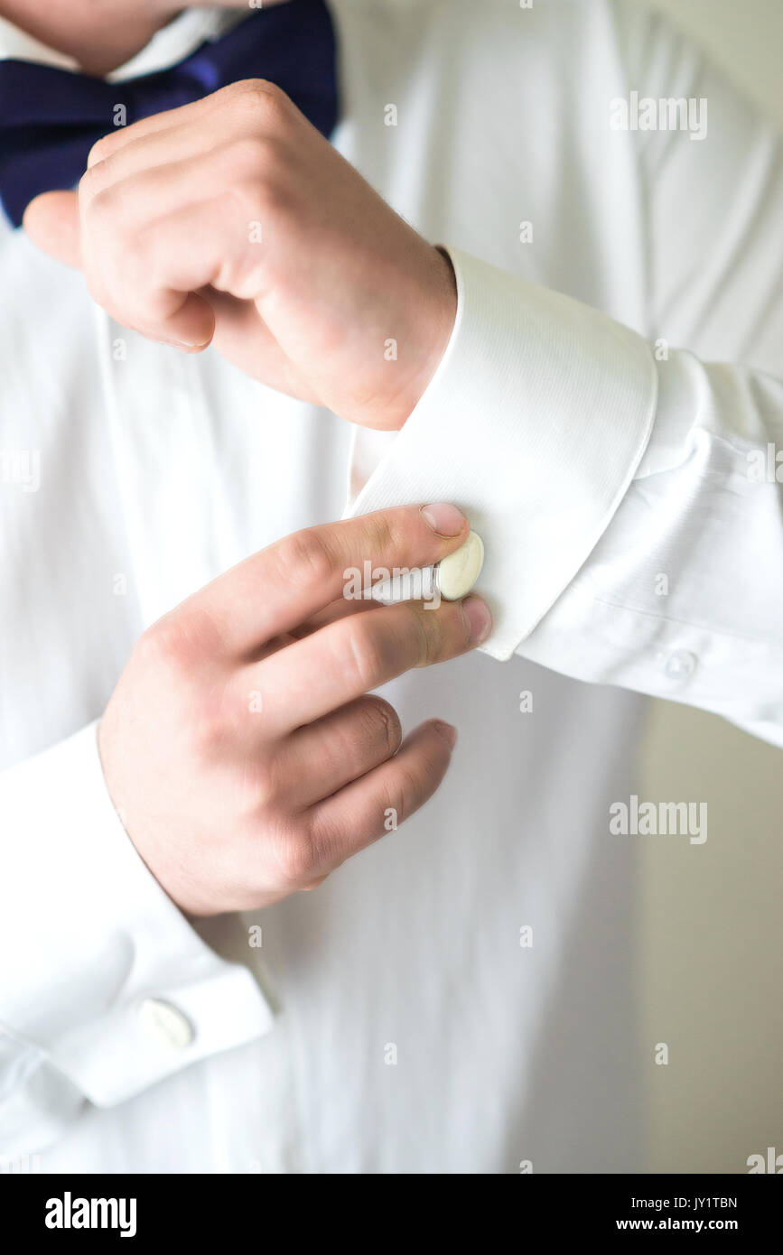 Man fastening a cuff Stock Photo - Alamy