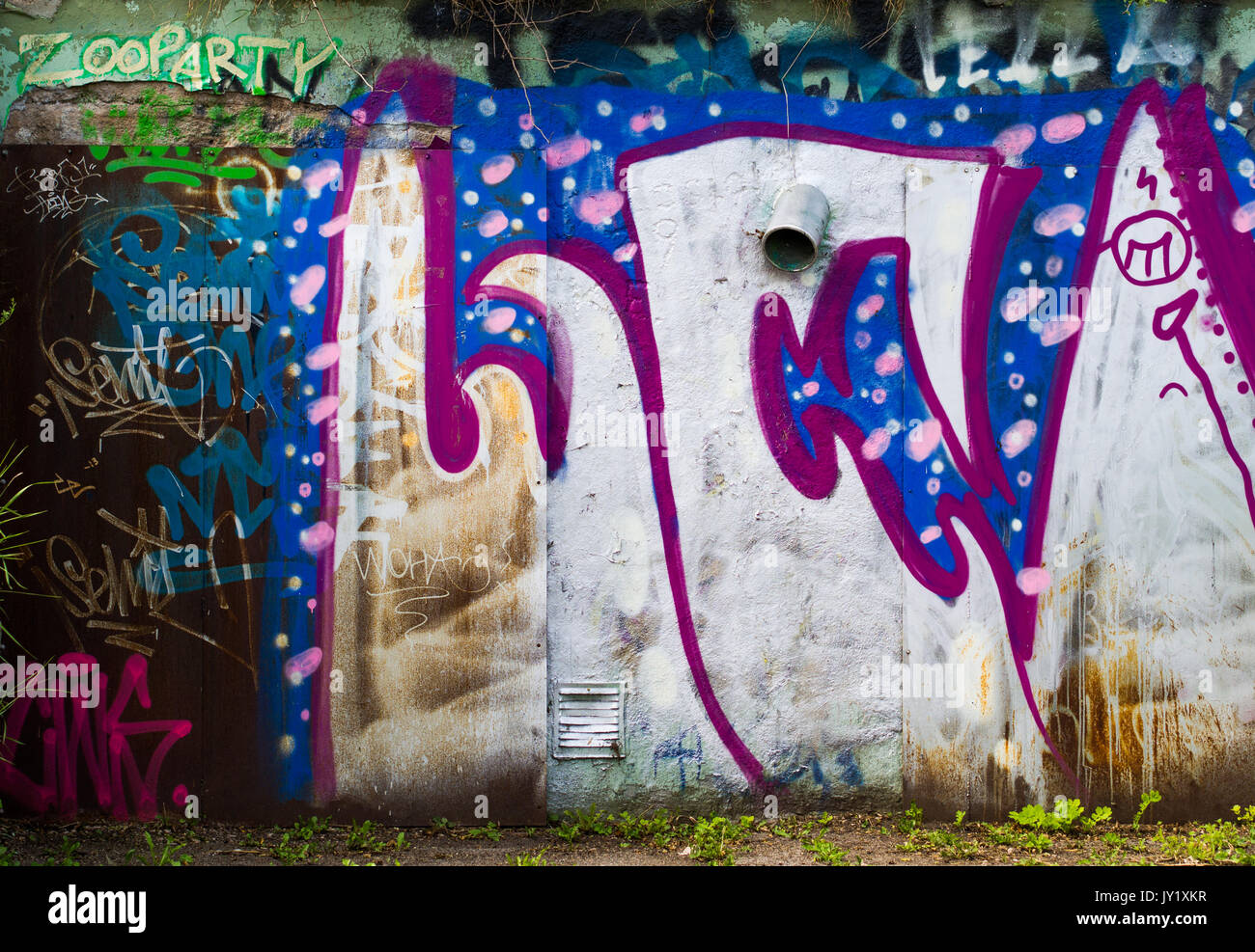 Wall covered in graffiti Stock Photo - Alamy