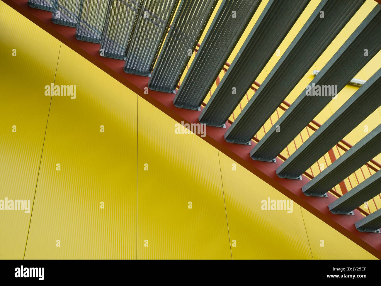 steel steps at yellow facade Stock Photo - Alamy