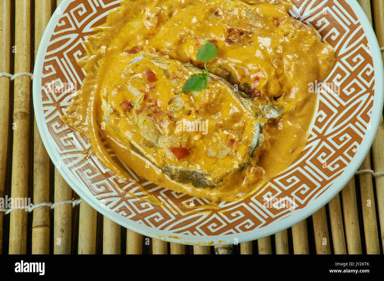Bengali mustard fish Curry. Fish cooked with masala in mustard oil ...