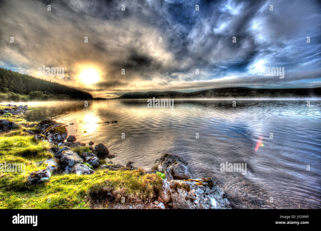 Area of Altnaharra, Scotland. Picturesque silhouetted sunrise view of ...