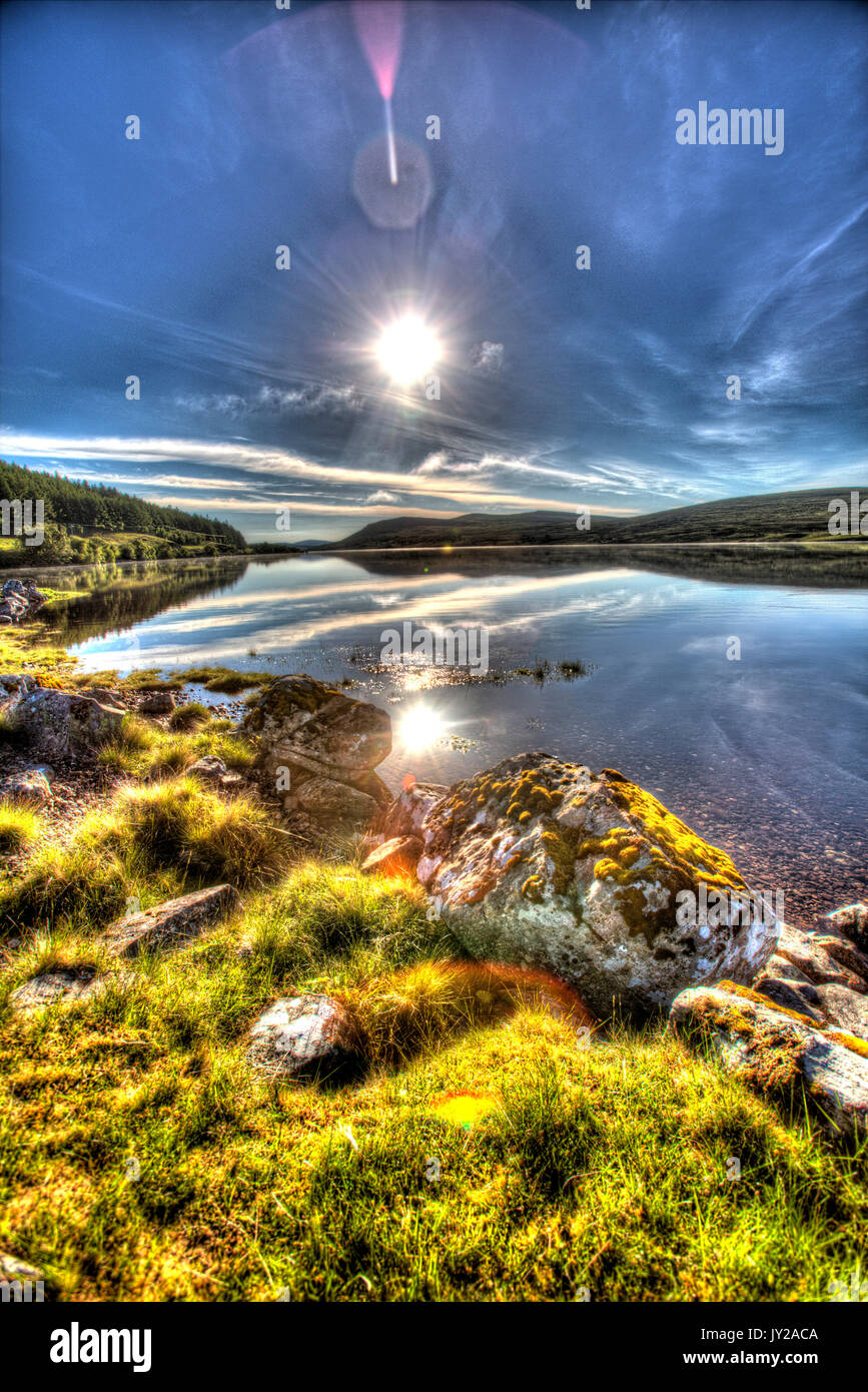 Area of Altnaharra, Scotland. Picturesque silhouetted sunrise view of ...