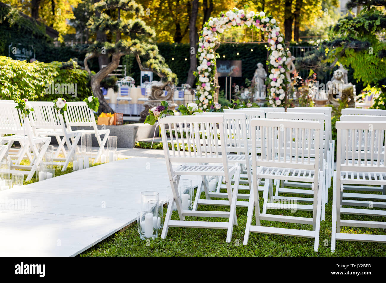 Wedding arch with flowers outdoors. Beautiful wedding set up. Wedding ...