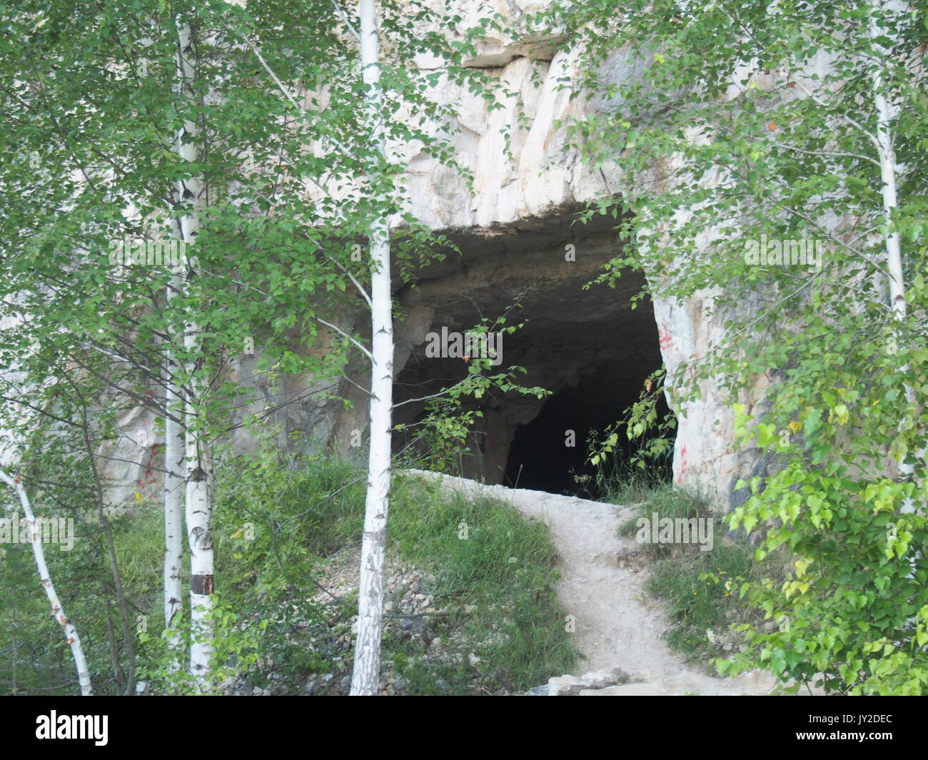 The entrance to the cave. Cave in the rock. Tunnel in Shiryaevo, Samara ...