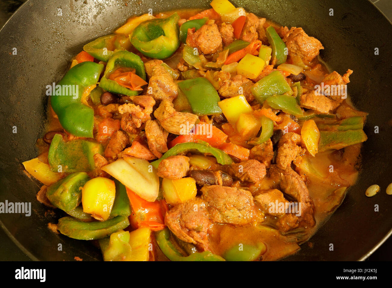Chicken and Vegetable stir fry fast food cooking in wok Stock Photo - Alamy